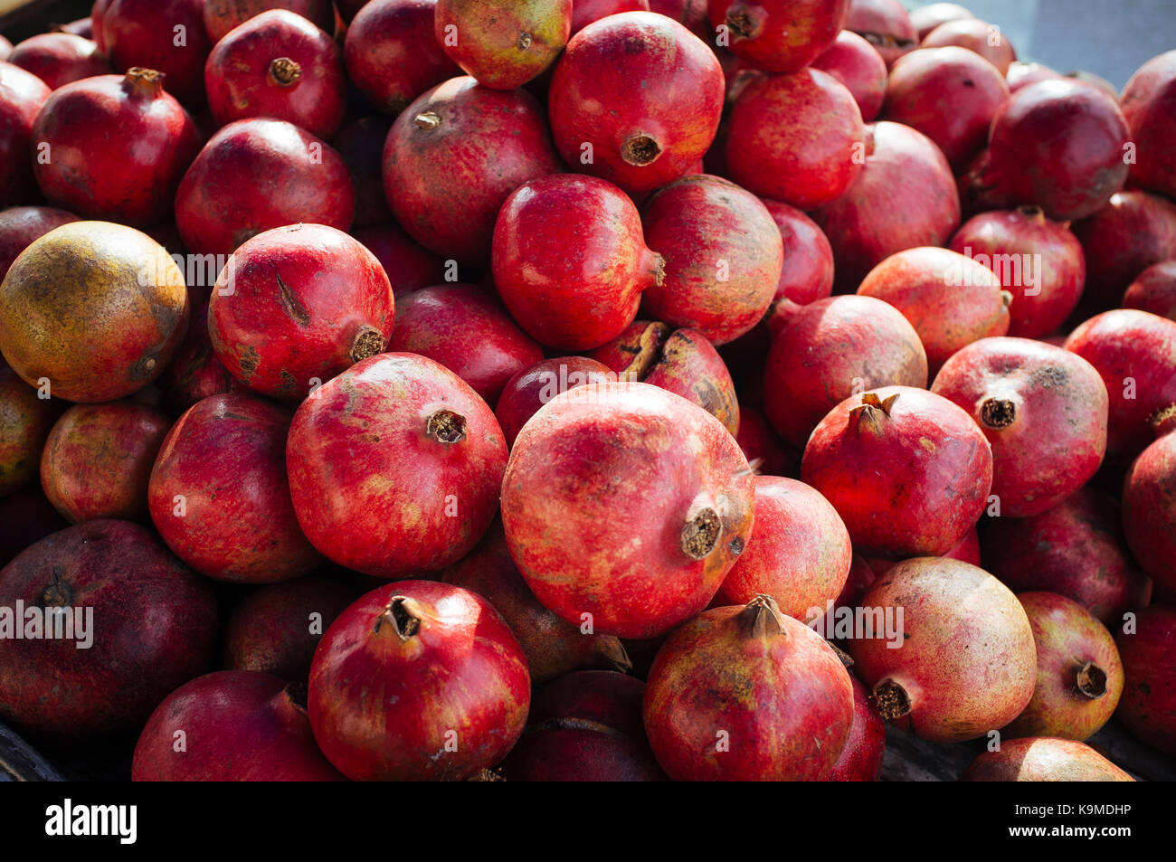 Fresh pomegranate and sweet red fruit Stock Photo - Alamy