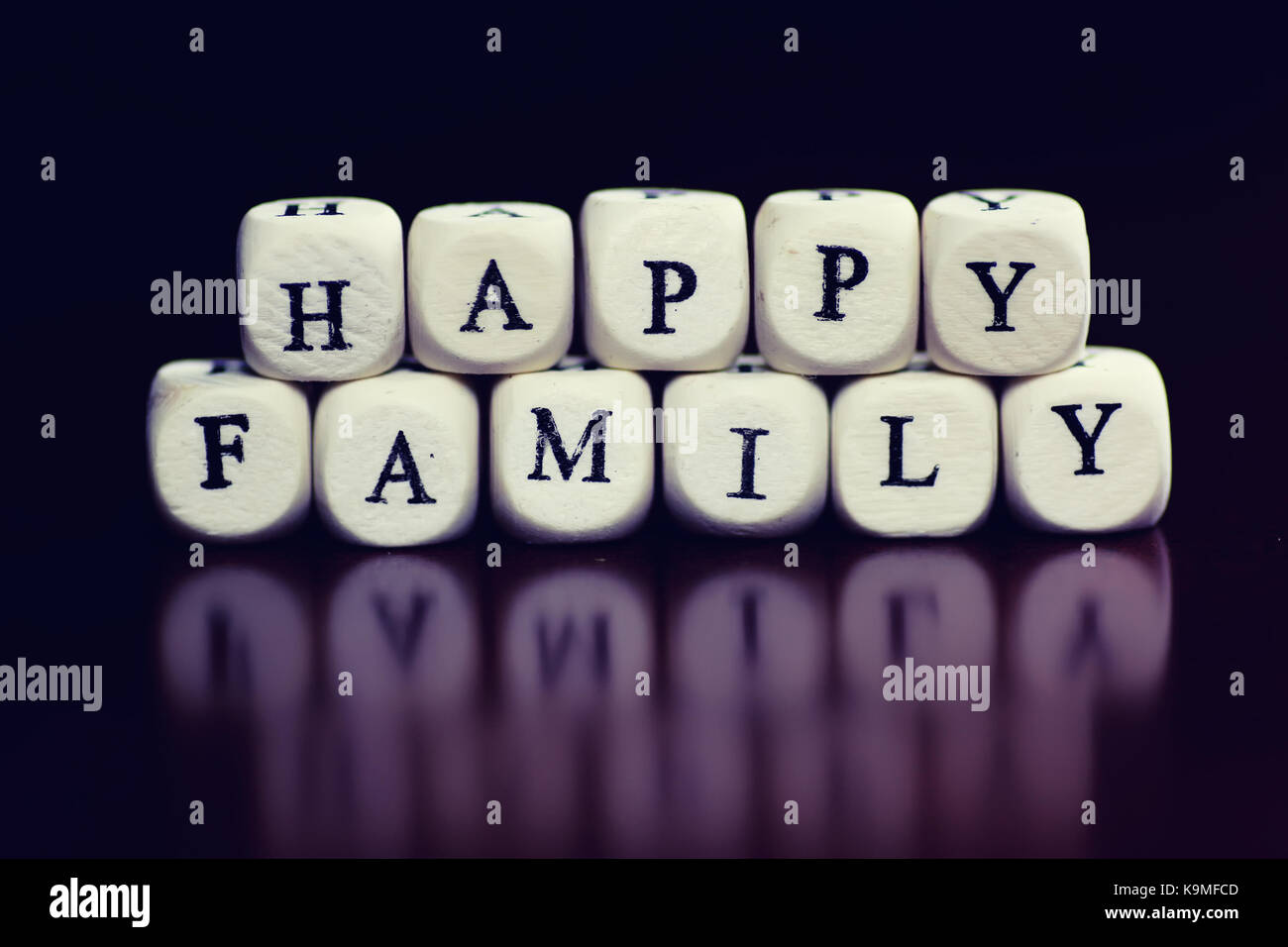 wood text cube family Stock Photo - Alamy