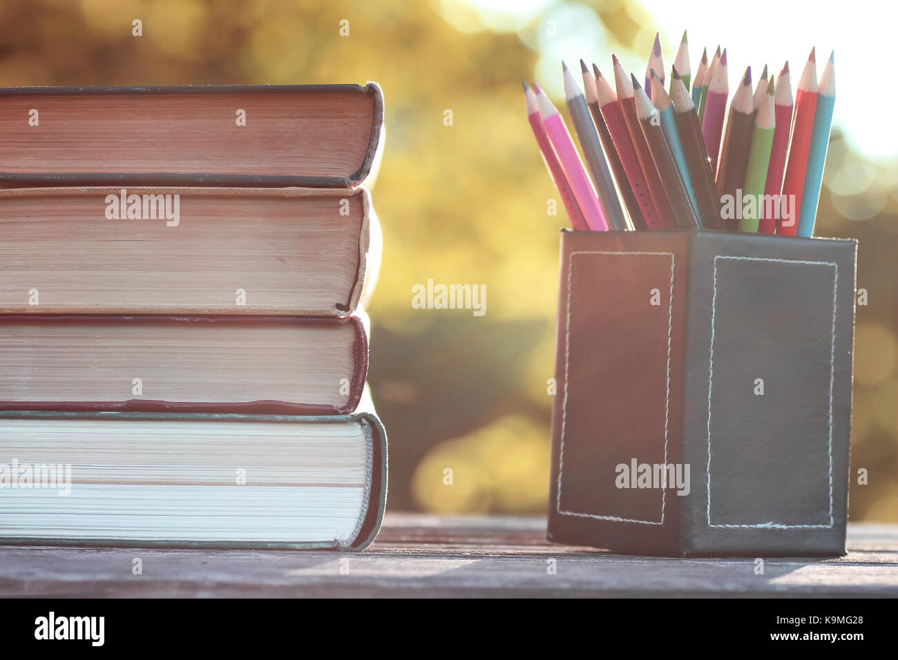 autumn book stack wooden outdoor Stock Photo - Alamy