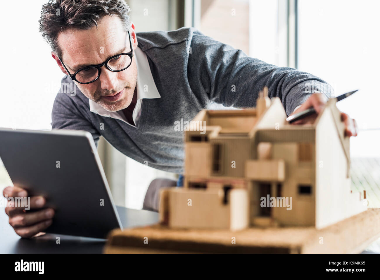 Architect working on architectural model Stock Photo - Alamy