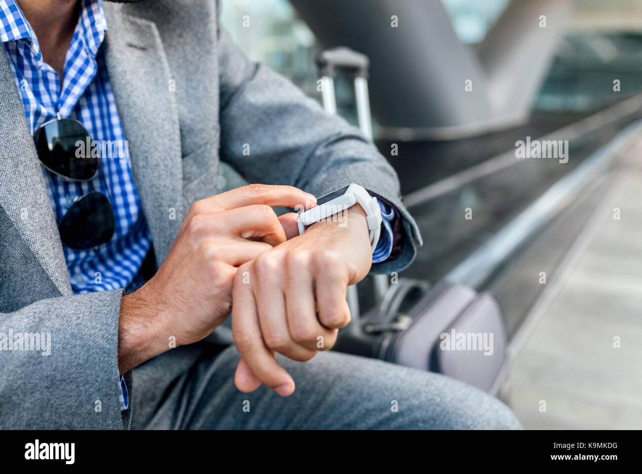 Close-up of businessman using his smartwatch in the city Stock Photo ...