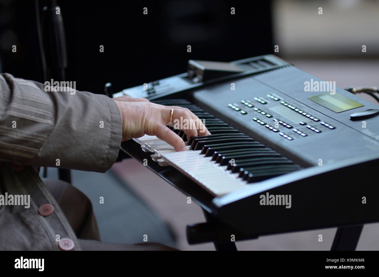 Jazz concert. Musician’s hand striking a chord on electric piano Stock ...
