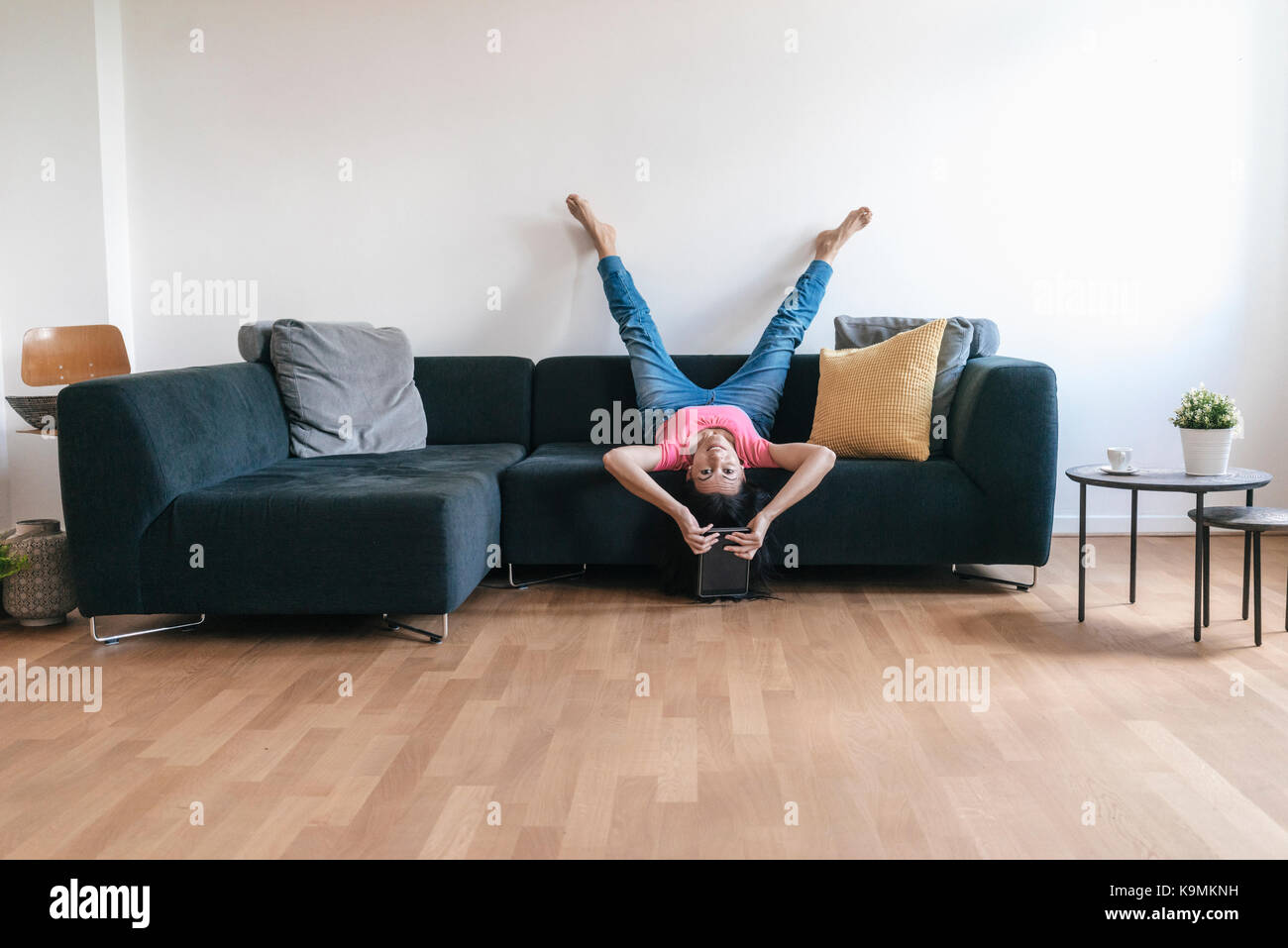 Woman upside down on couch one person hi-res stock photography and ...