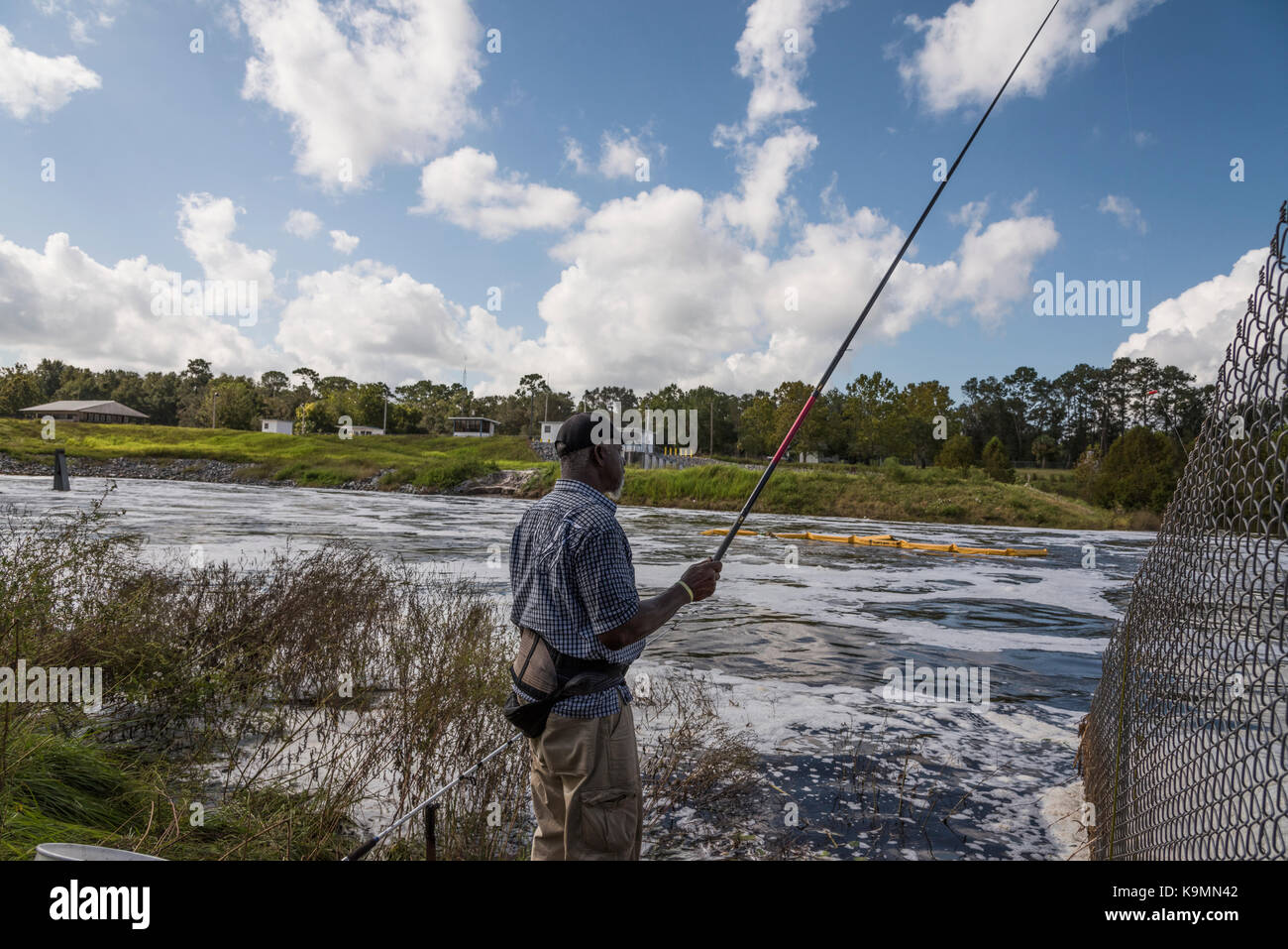 Men fishing the Moss Bluff Spillway in Marion County, Florida with the ...