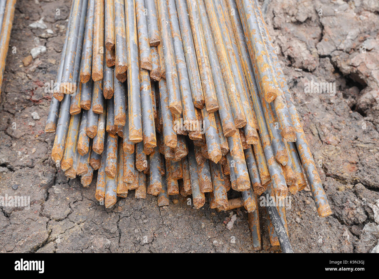 Stack of rusty round steel bar - iron metal rail lines material for ...
