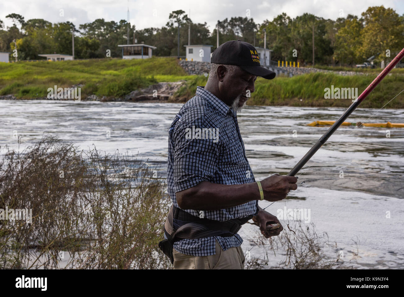 Men fishing the Moss Bluff Spillway in Marion County, Florida with the ...