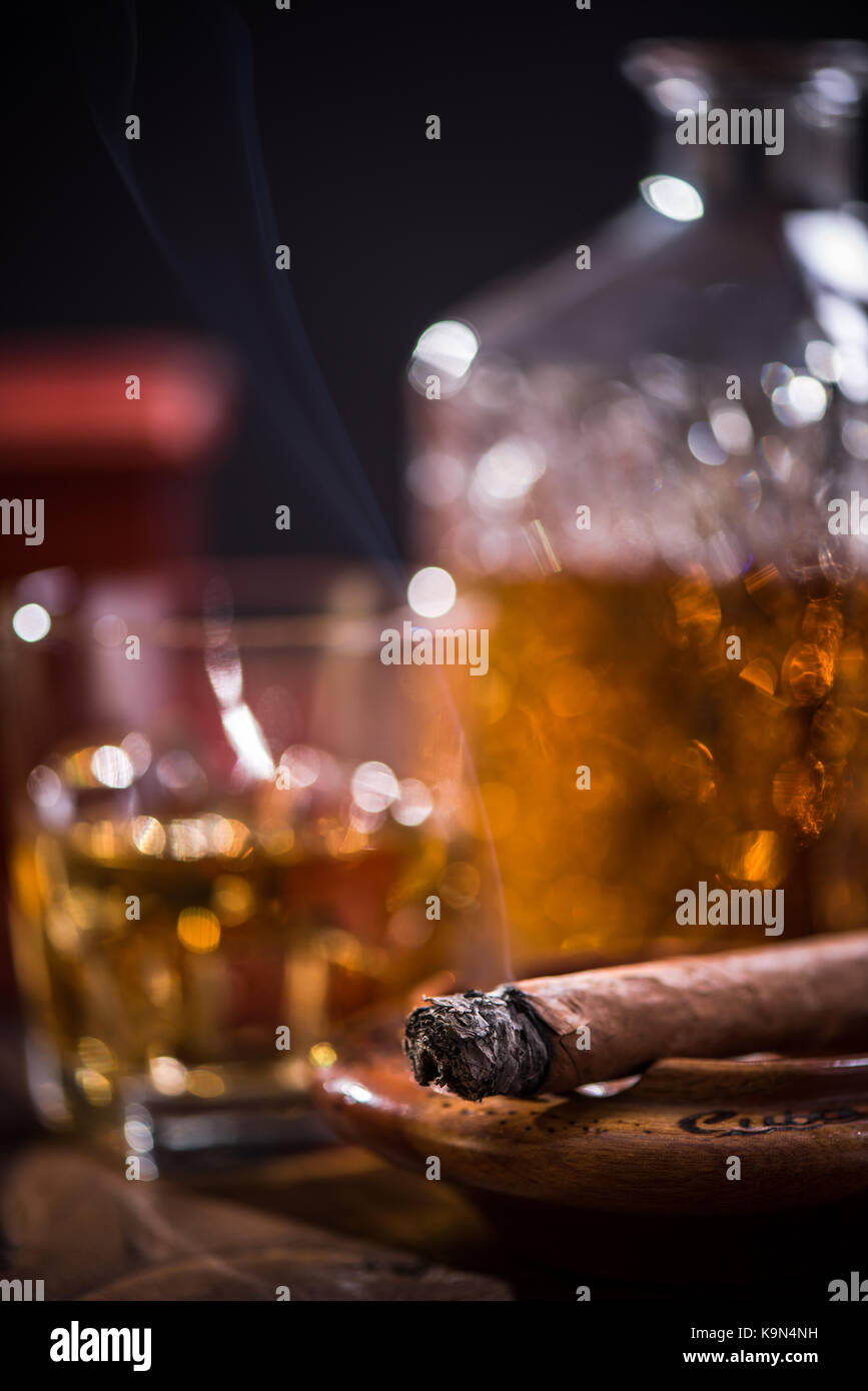Cuban cigar and expensive alcohol in carafe Stock Photo - Alamy