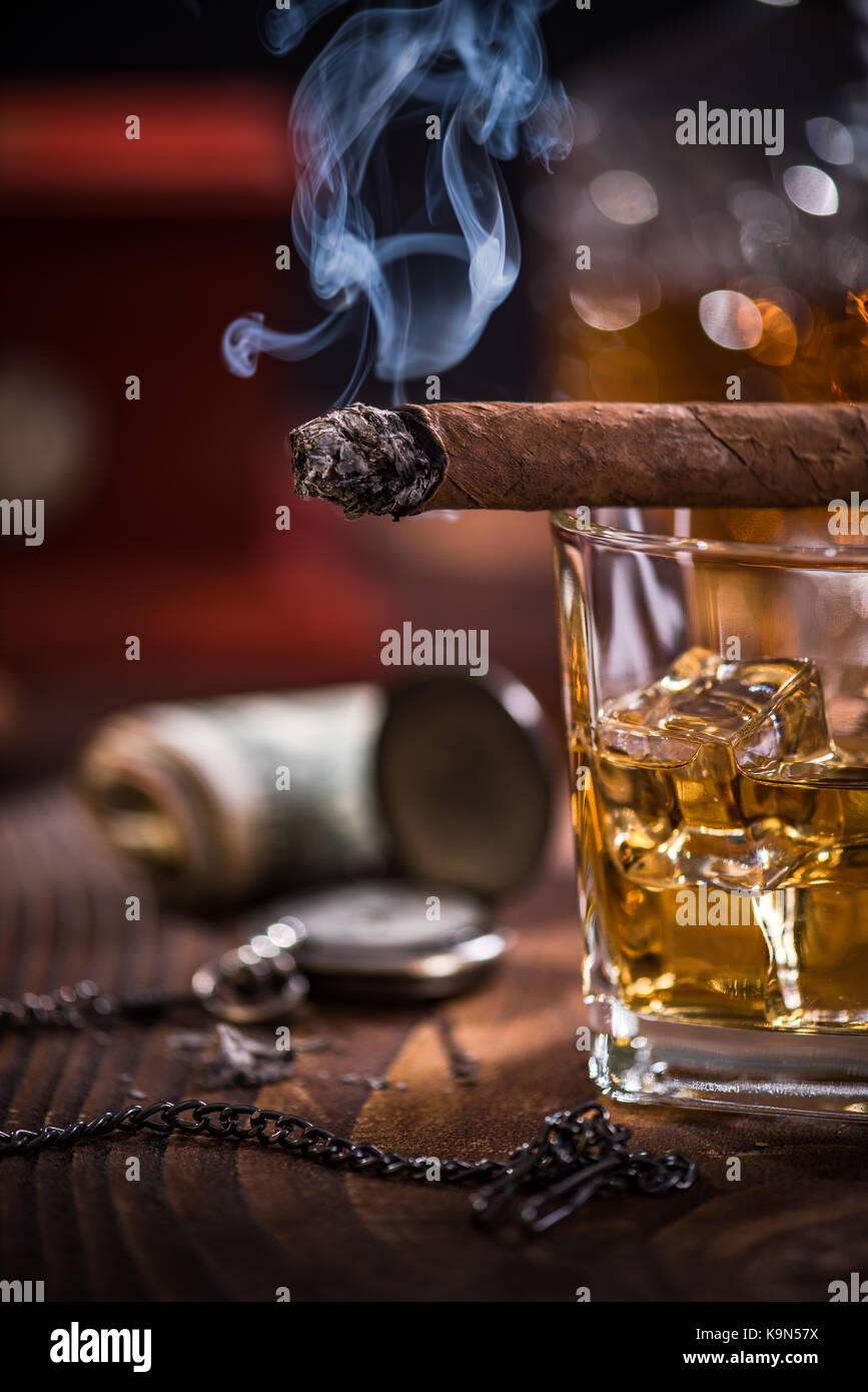 Smoke from Cuban Cigar and luxurious items in background Stock Photo ...