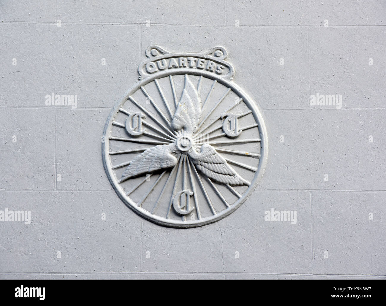 ctc emblem of the cyclists touring club in relief on a wall. badge or ...
