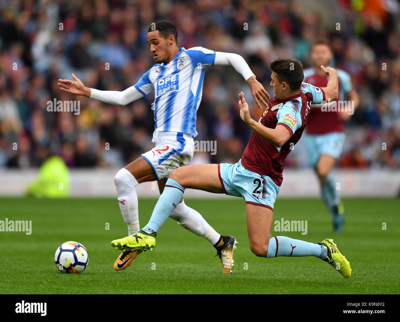 Huddersfield Town's Tom Ince (left) and Burnley's Matthew Lowton battle ...