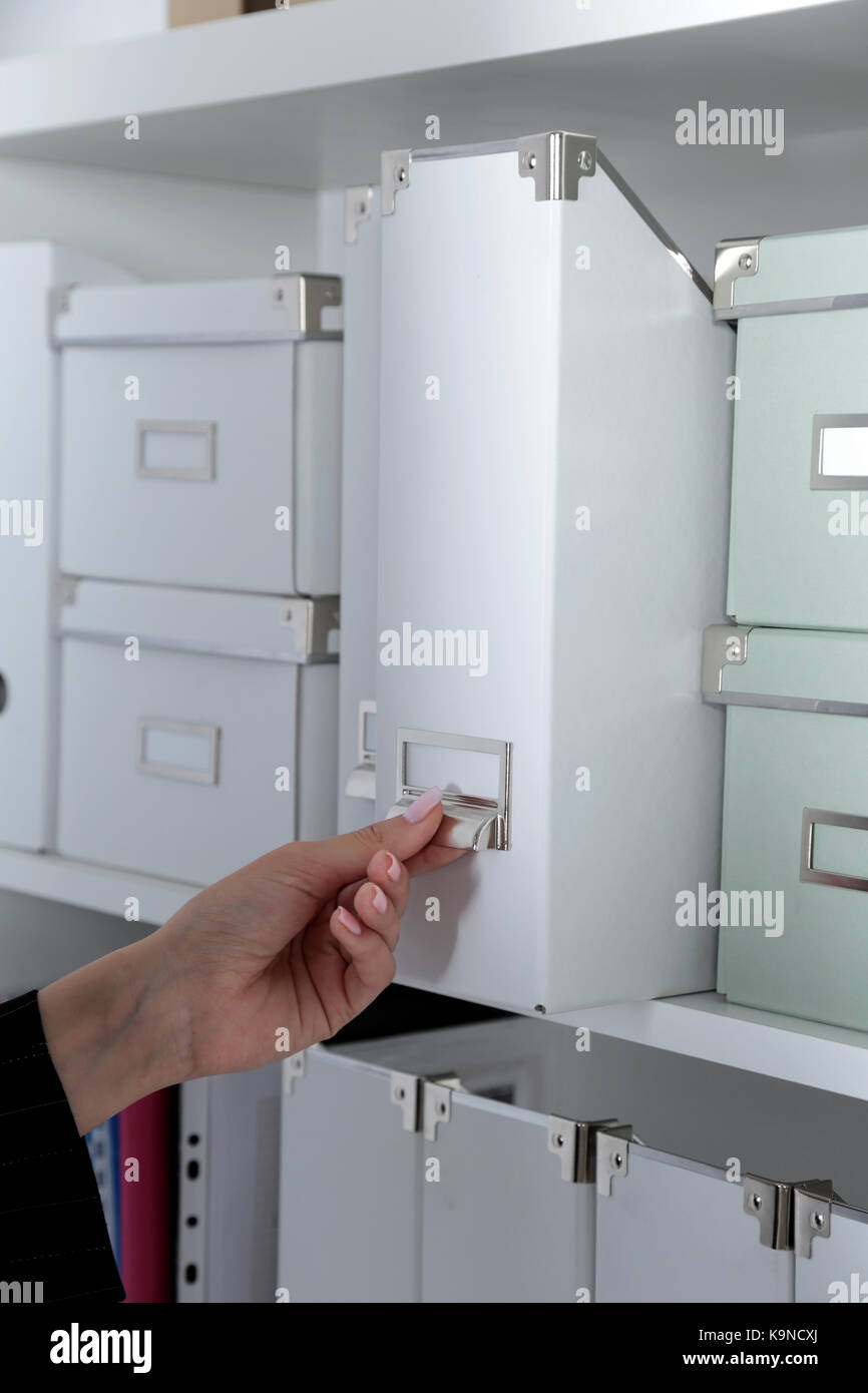 File folders, standing on shelves in the background Stock Photo - Alamy
