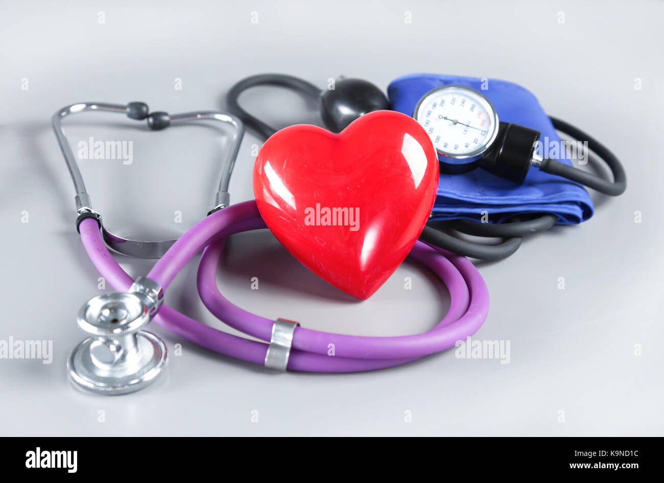 Medical instruments and red heart for ENT doctor on white Stock Photo ...