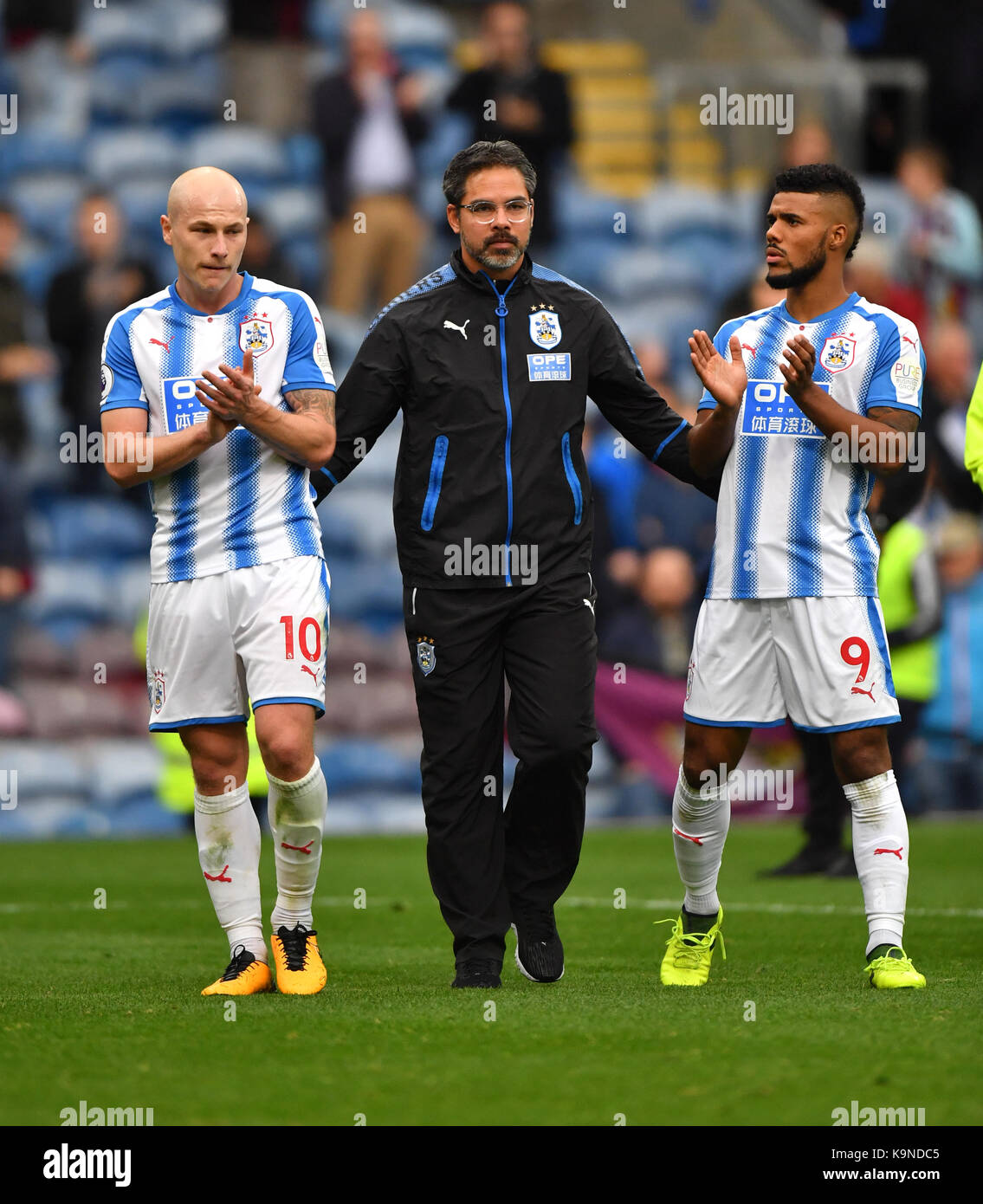 Huddersfield Town manager David Wagner (centre) with Aaron Mooy (left ...