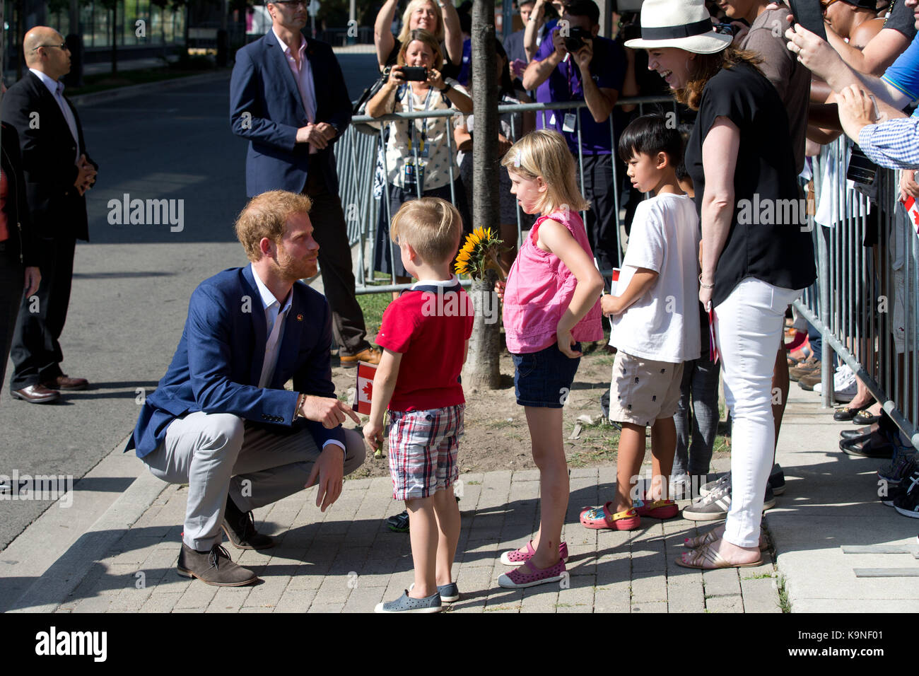 Prince Harry speaks to Christine Hamilton and her daughter Harper and ...