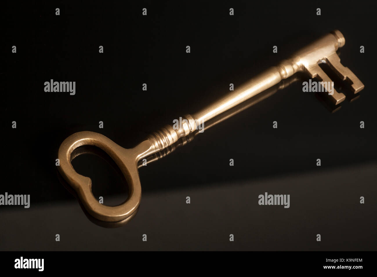 Vintage Key on black background Stock Photo - Alamy