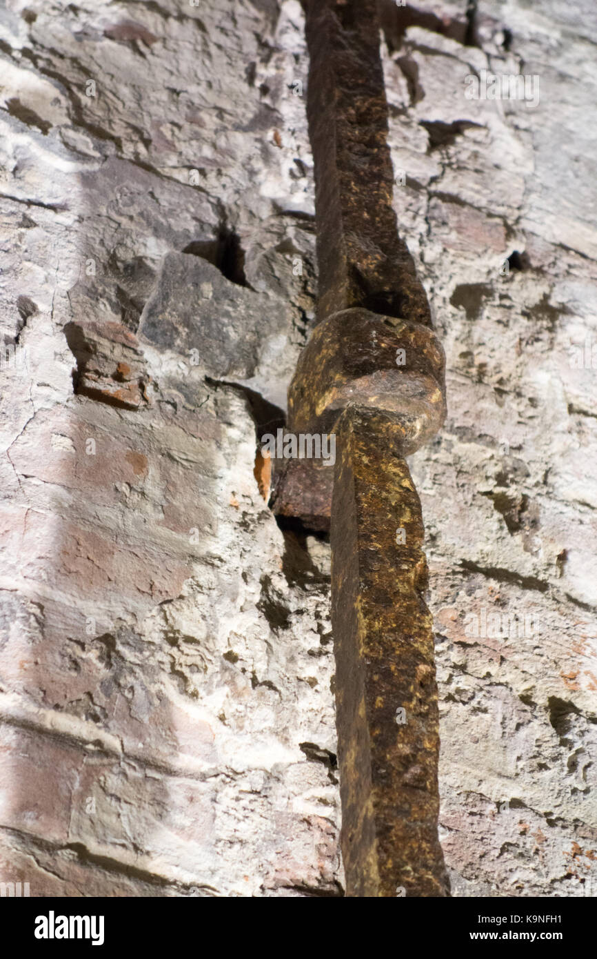 Close up metalwork structure attached to wall Stock Photo - Alamy