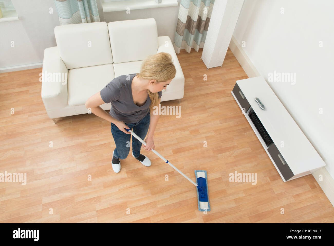 Woman mopping floor hi-res stock photography and images - Alamy