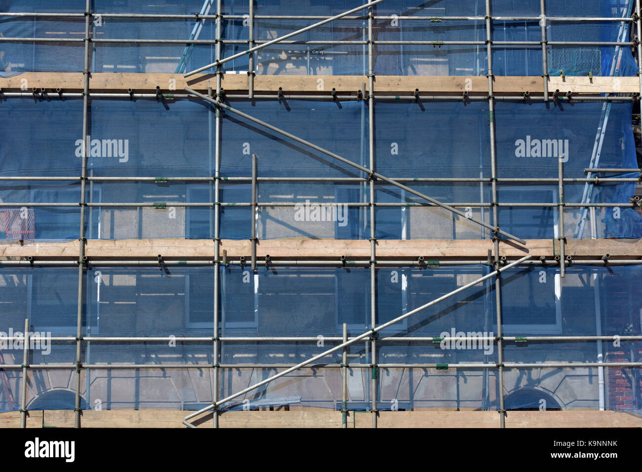 Some scaffolding erected on the front of a period building to allow ...