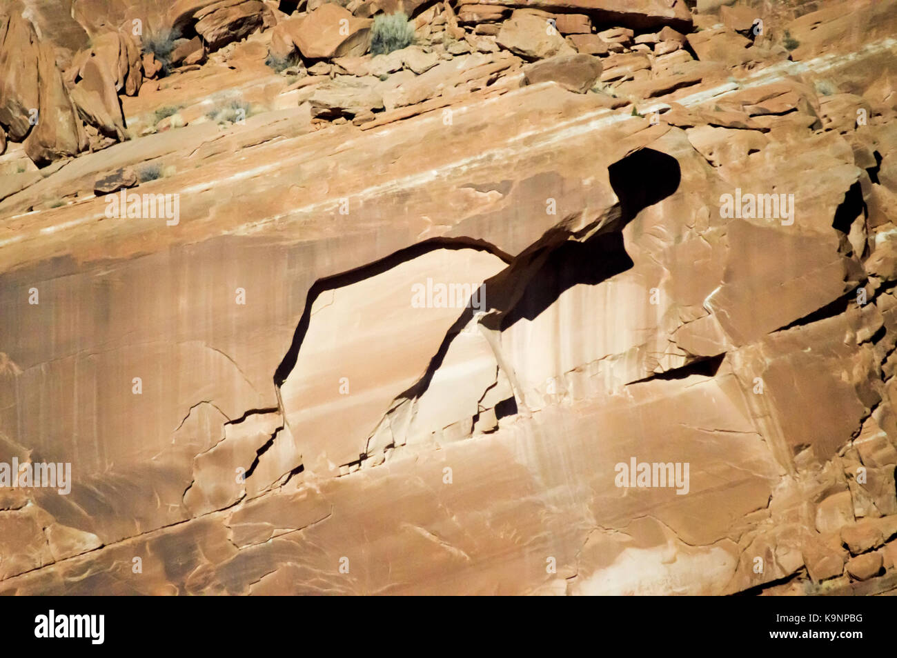 A rocky outcrop formation inset with heavy shadows Stock Photo - Alamy