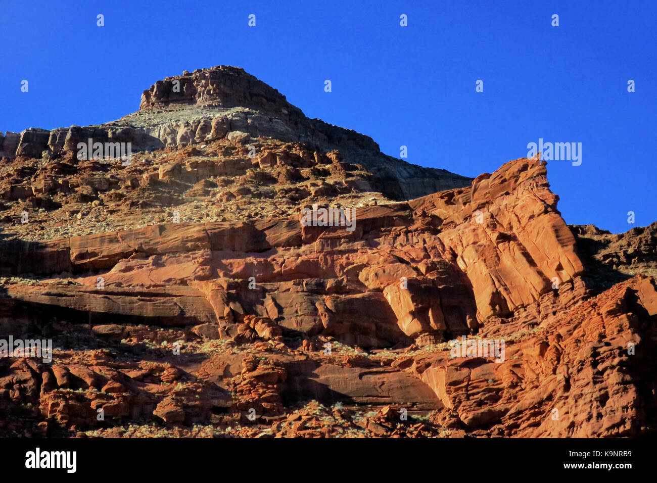 A canyon of red rock on a bright blue sky Stock Photo - Alamy