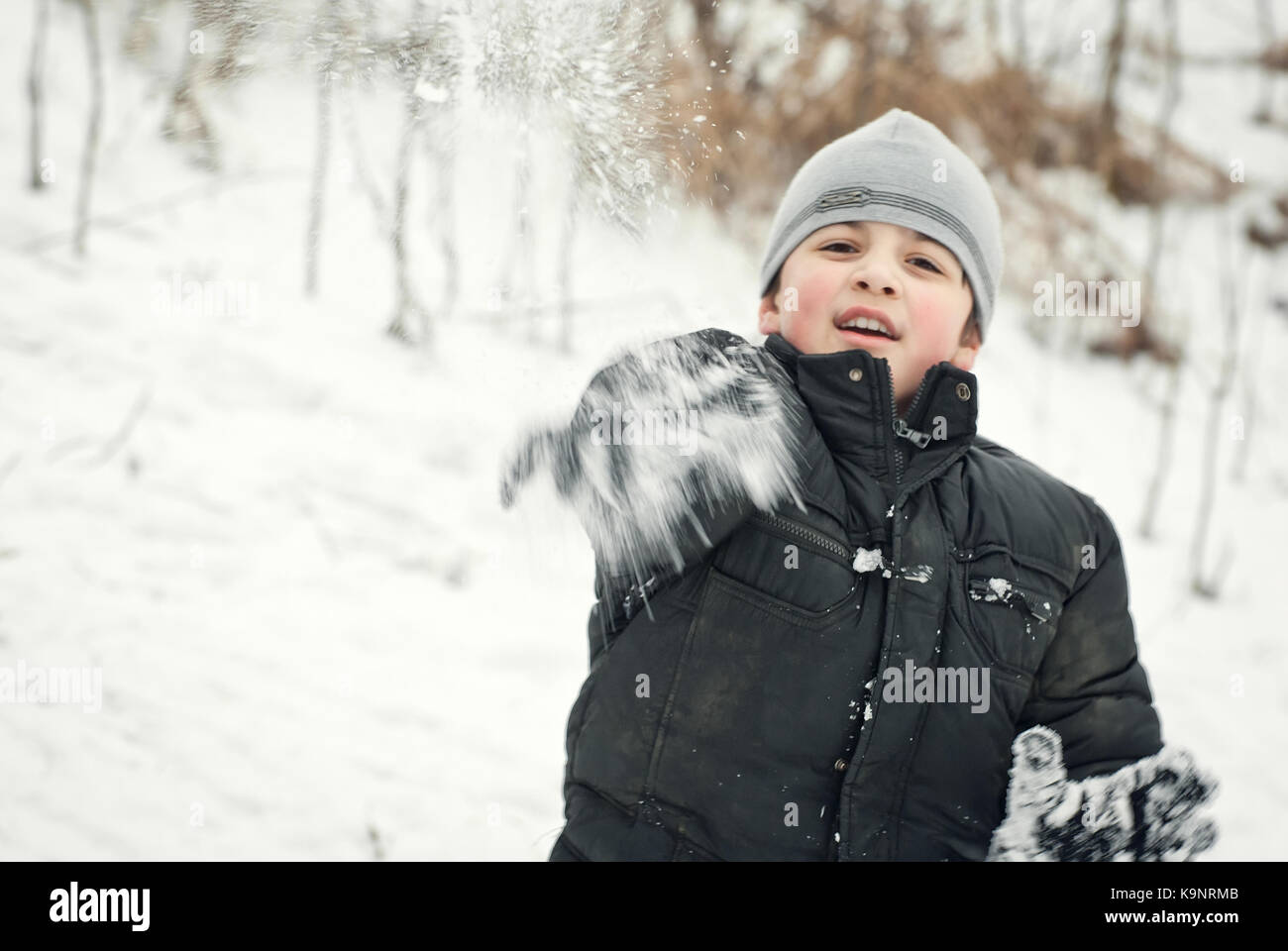 the guys are playing in the snow in the winter with emotions Stock ...
