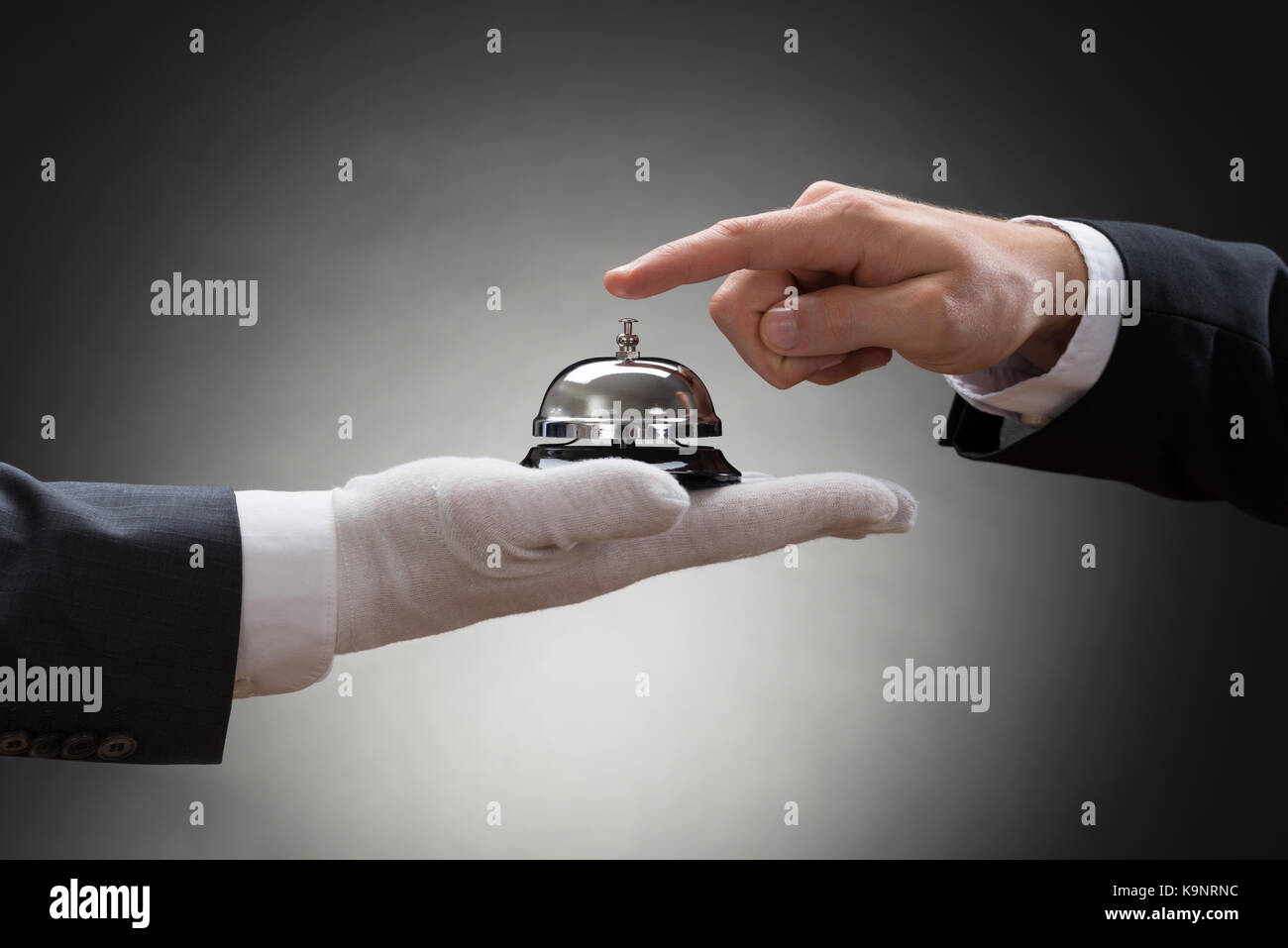 Close-up Of A Person's Hand Ringing Service Bell Hold By Waiter Stock ...