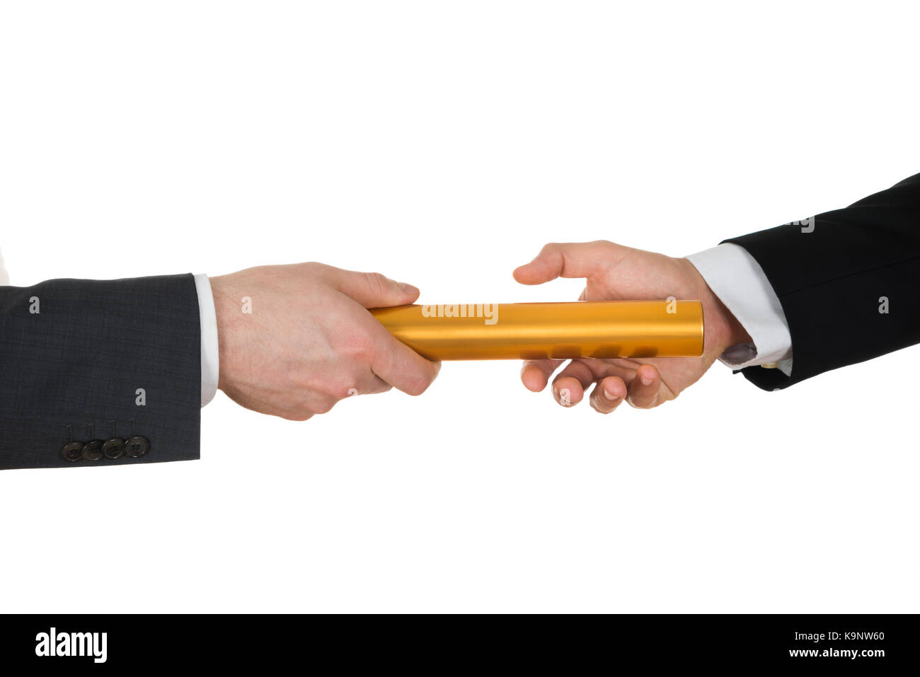 Close-up Of Two Businessman's Hand Passing A Golden Relay Baton Over ...
