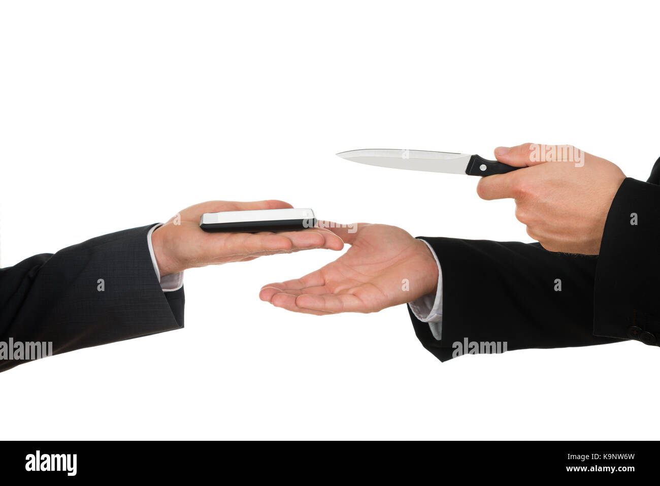 Businessman Hand Showing Knife To The Businessperson With Mobile Phone ...