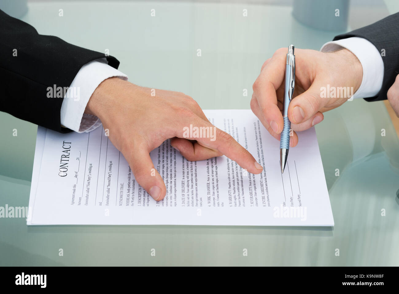 Person Pointing On Paper To Sign On Contract Stock Photo - Alamy