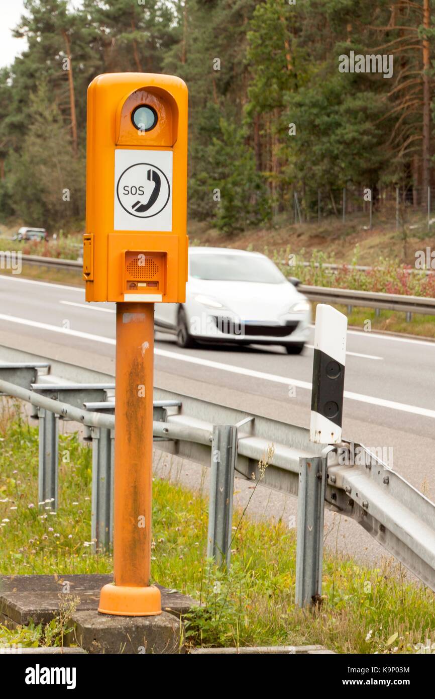 SOS phone. Emergency telephone at the roadside. Morning on the German ...