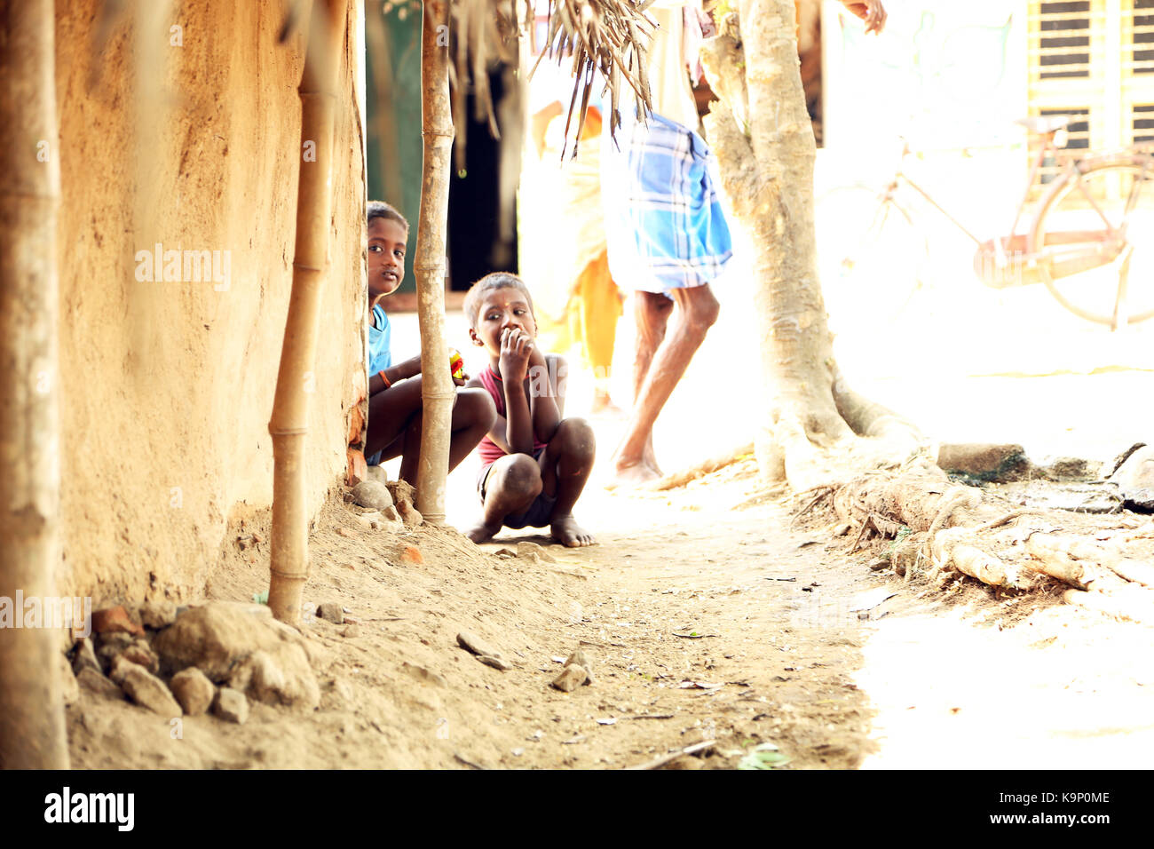 Indian village children sitting house exterior looking at camera Stock ...