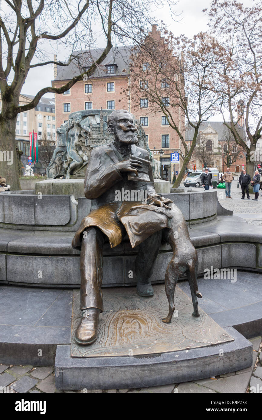 Statue of seated man and dog in metal Brussels in spring Stock Photo ...
