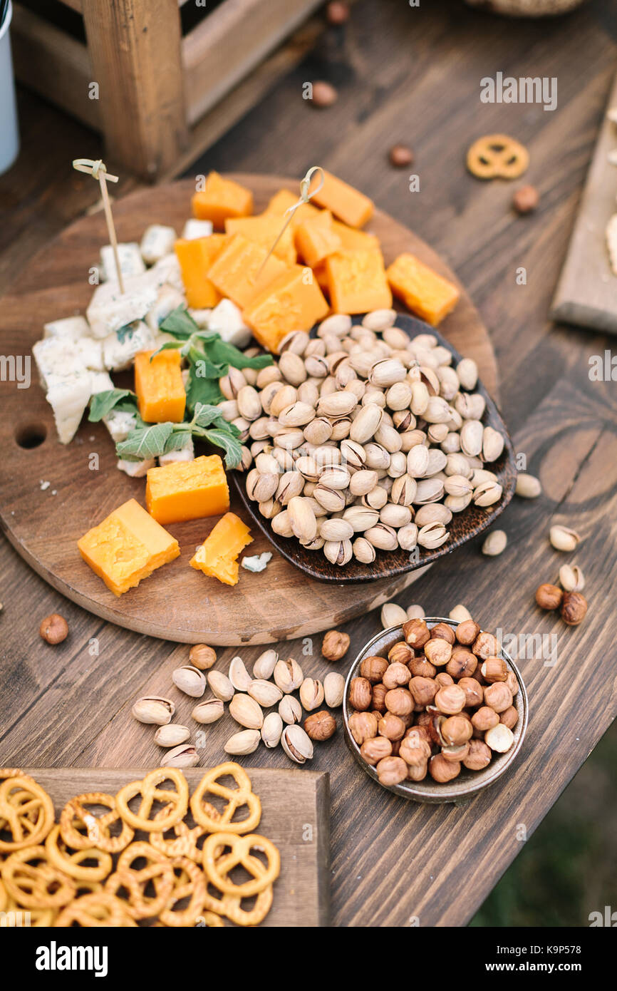 food, refreshment, treatment concept. close up of various snackes ...