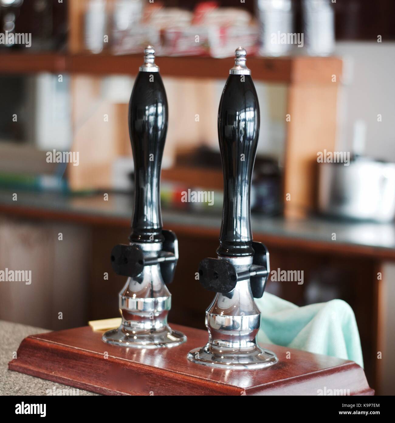 Two long bar beer tap on the wooden table. Restaurant drink concept ...