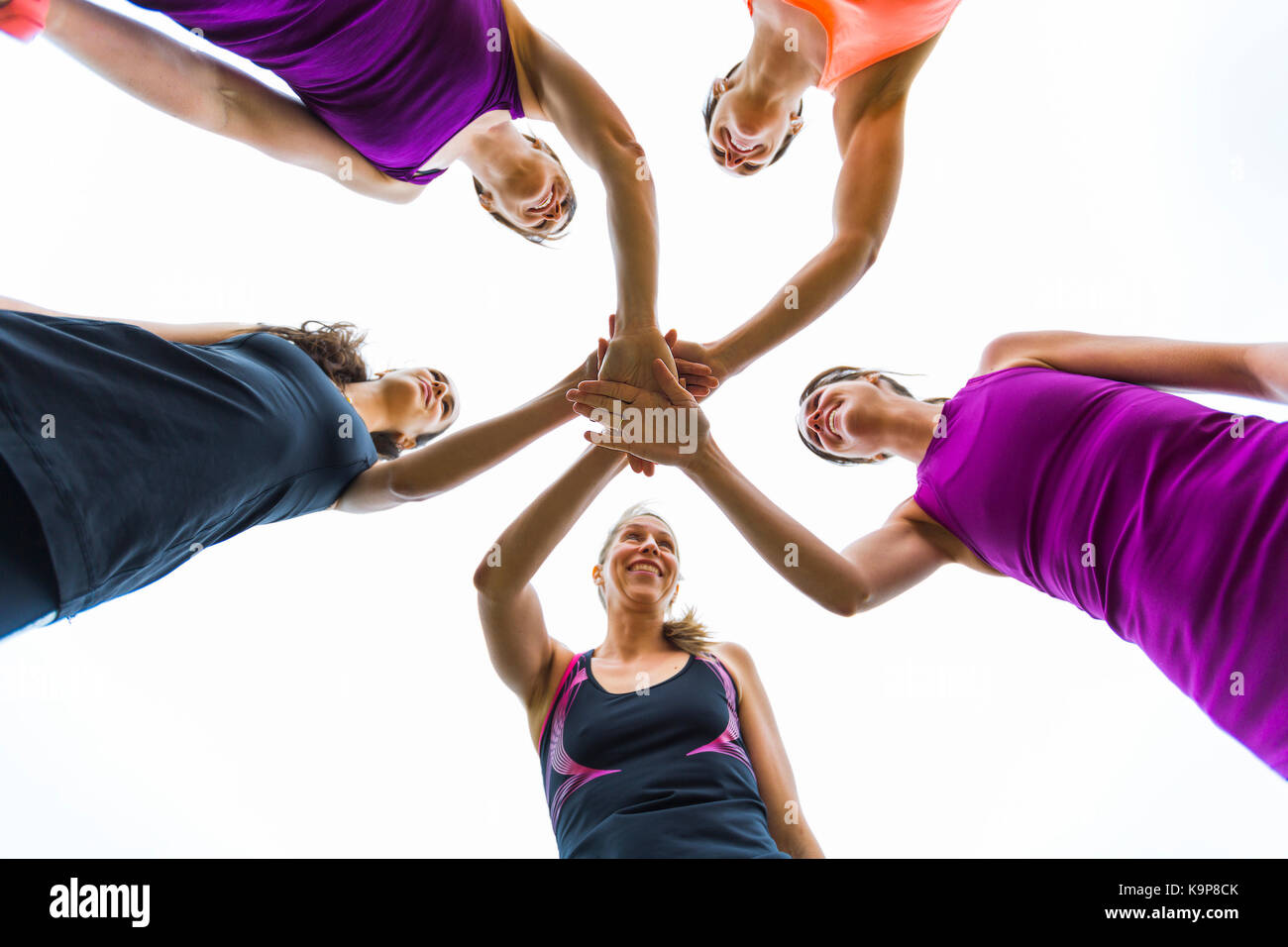 A Happy running team having fun Stock Photo - Alamy