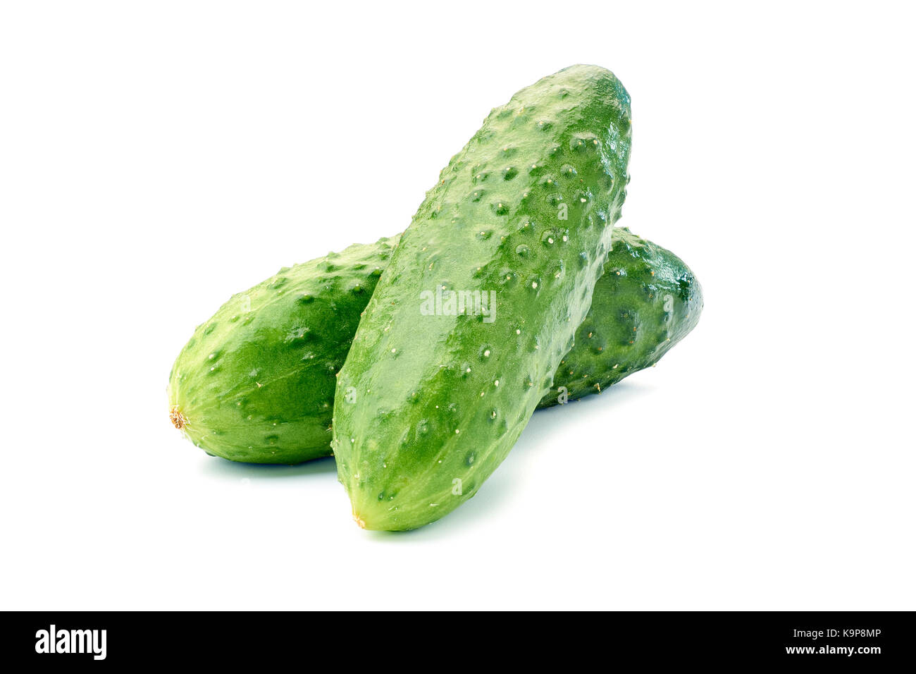Two fresh cucumbers on white Stock Photo - Alamy