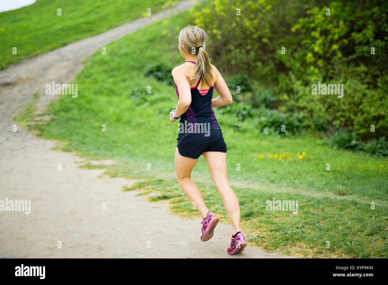 A nice portrait of a woman jogging outdoors Stock Photo - Alamy
