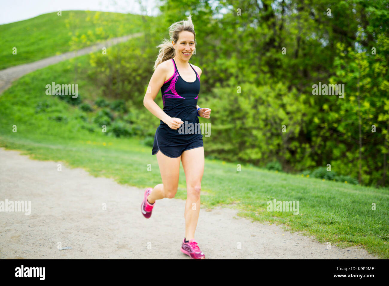 A nice portrait of a woman jogging outdoors Stock Photo - Alamy