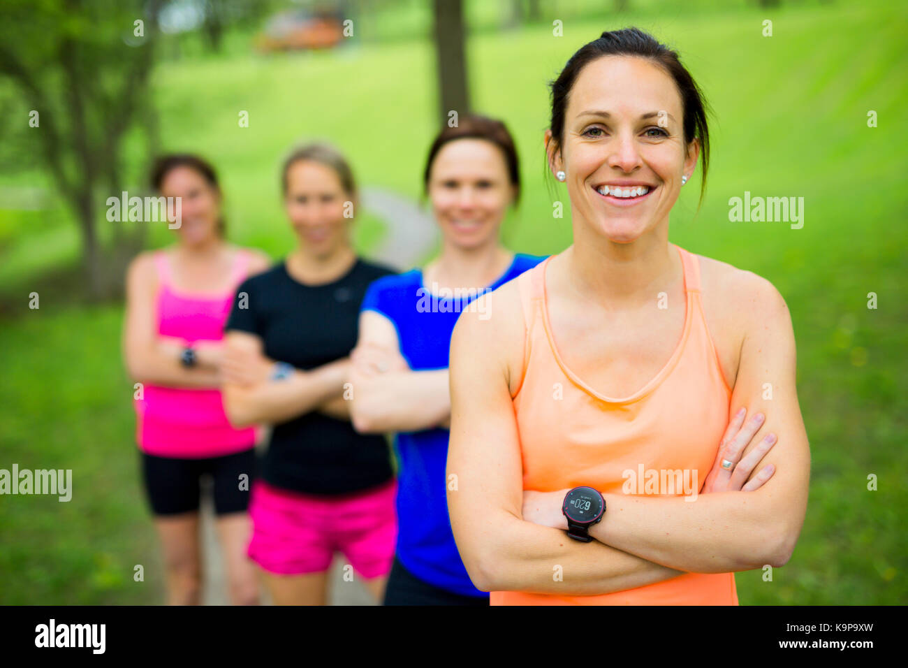 A group of people enjoying in the fitness having fun running outside ...