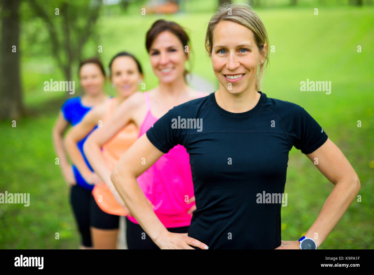 A group of people enjoying in the fitness having fun running outside ...