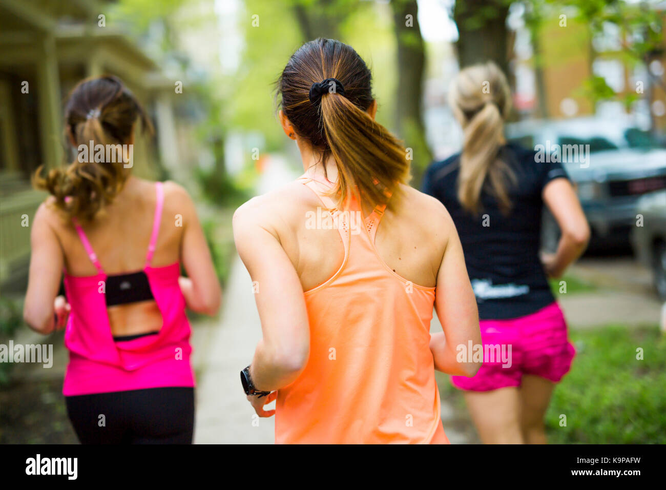 A group of people enjoying in the fitness having fun running outside ...