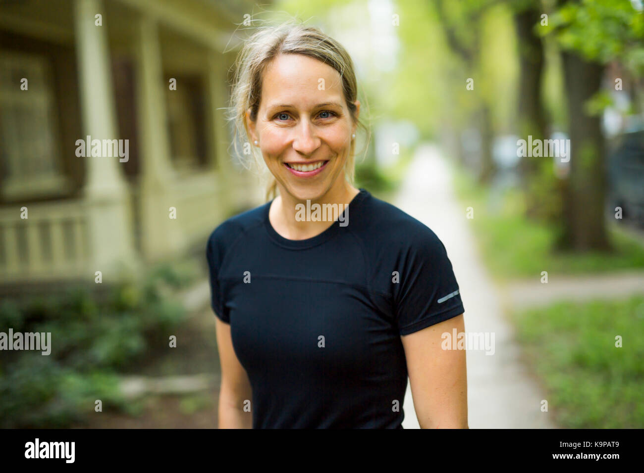 A nice portrait of a woman jogging outdoors Stock Photo - Alamy