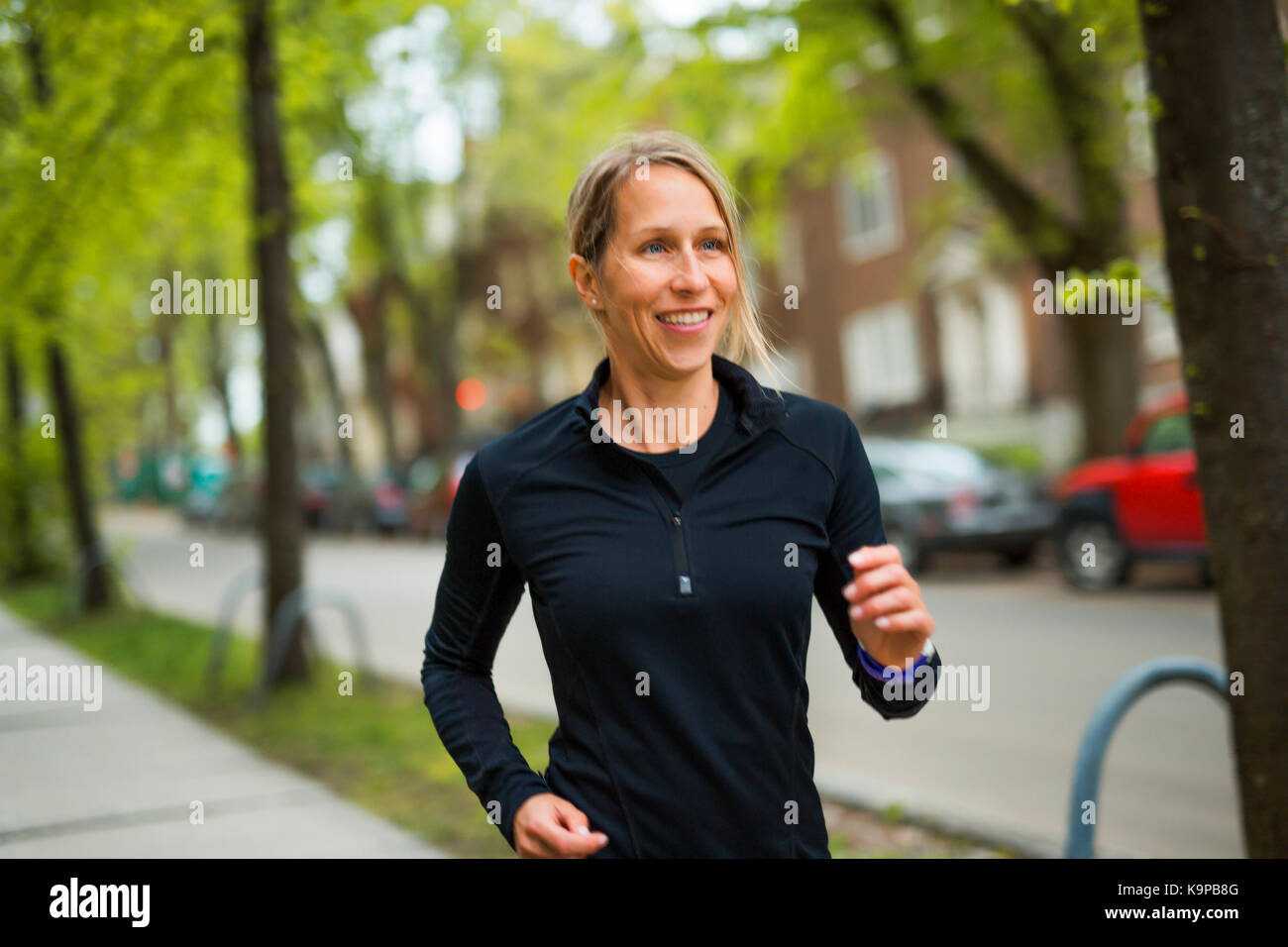 A nice portrait of a woman jogging outdoors Stock Photo - Alamy