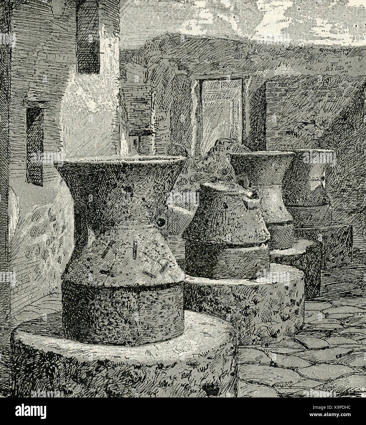 Pompei casa di un fornaio con macine da grano Stock Photo - Alamy