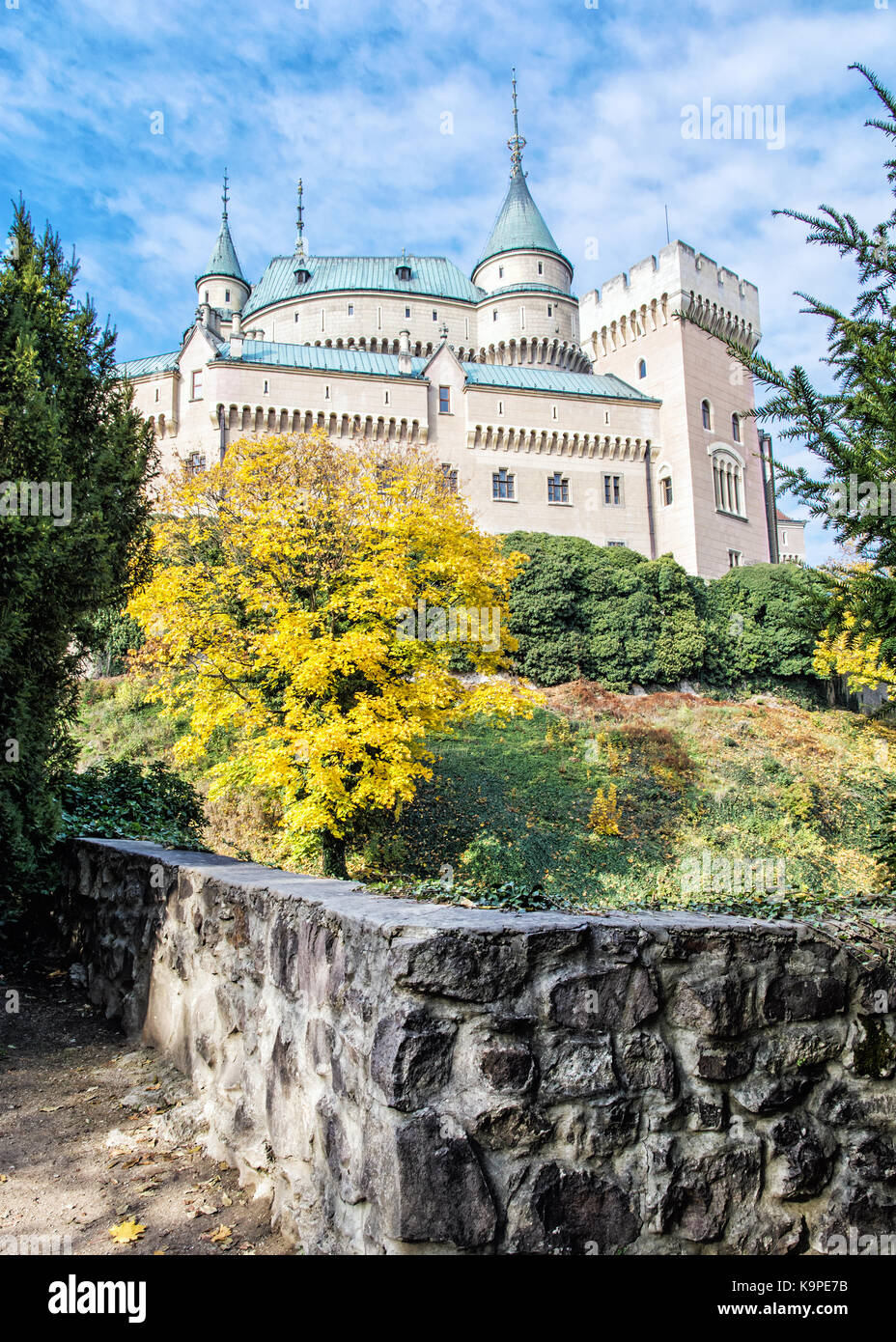 Bojnice castle in Slovak republic. Yellow autumn trees. Cultural ...