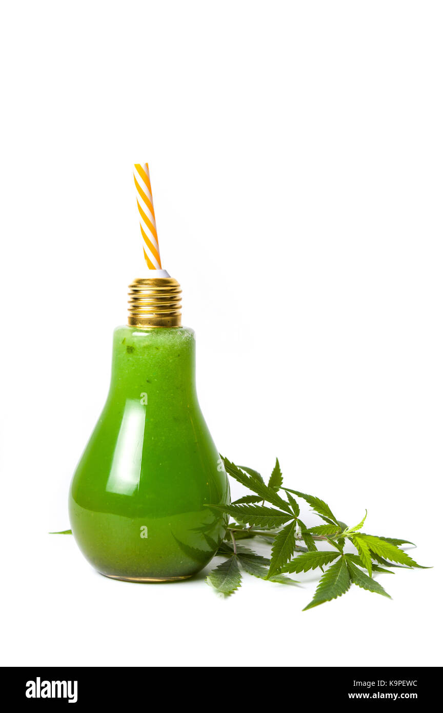 Green marijuana smoothie juice on white background Stock Photo - Alamy