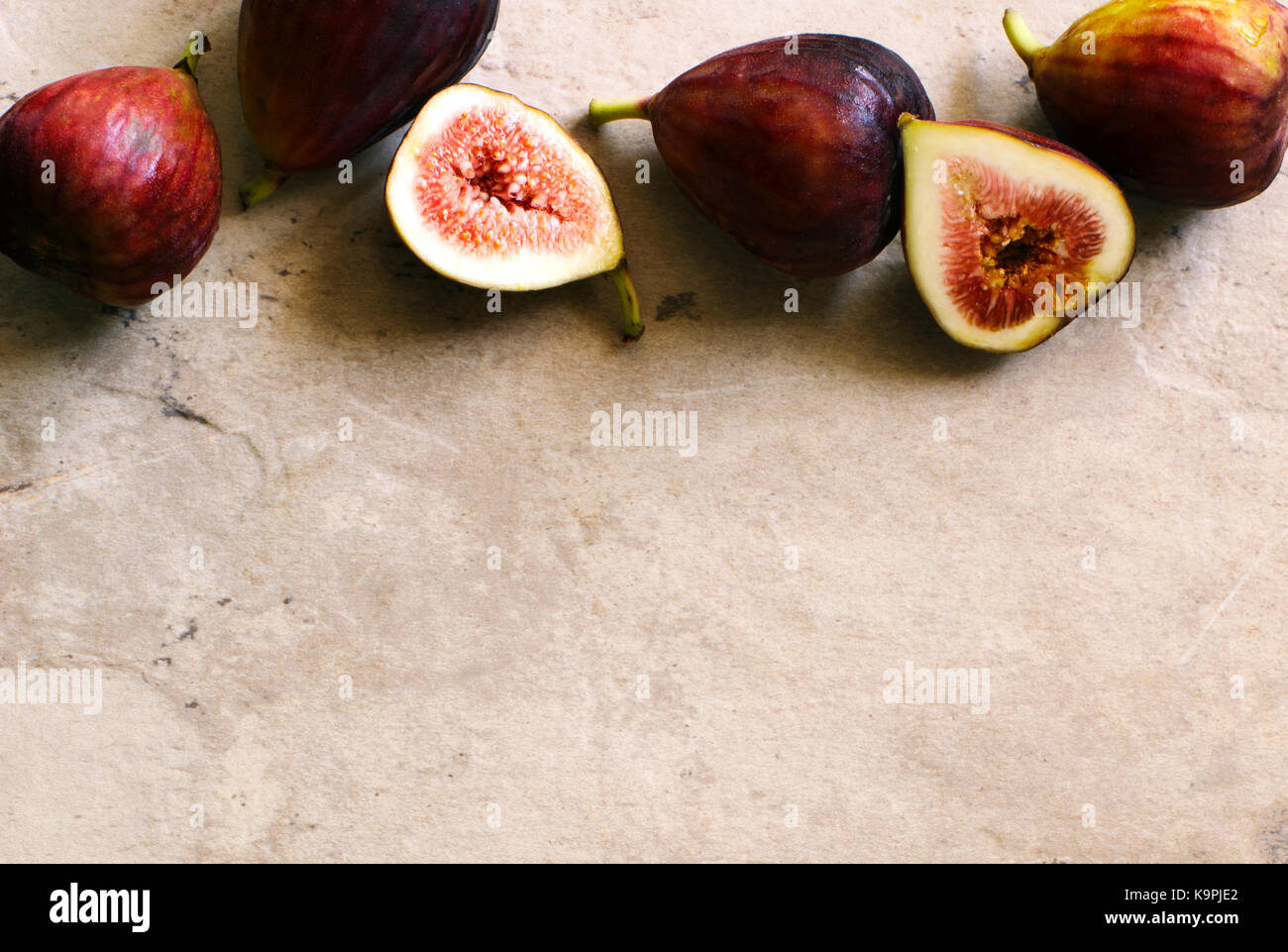 Fresh Figs on stone background with copy space Stock Photo - Alamy