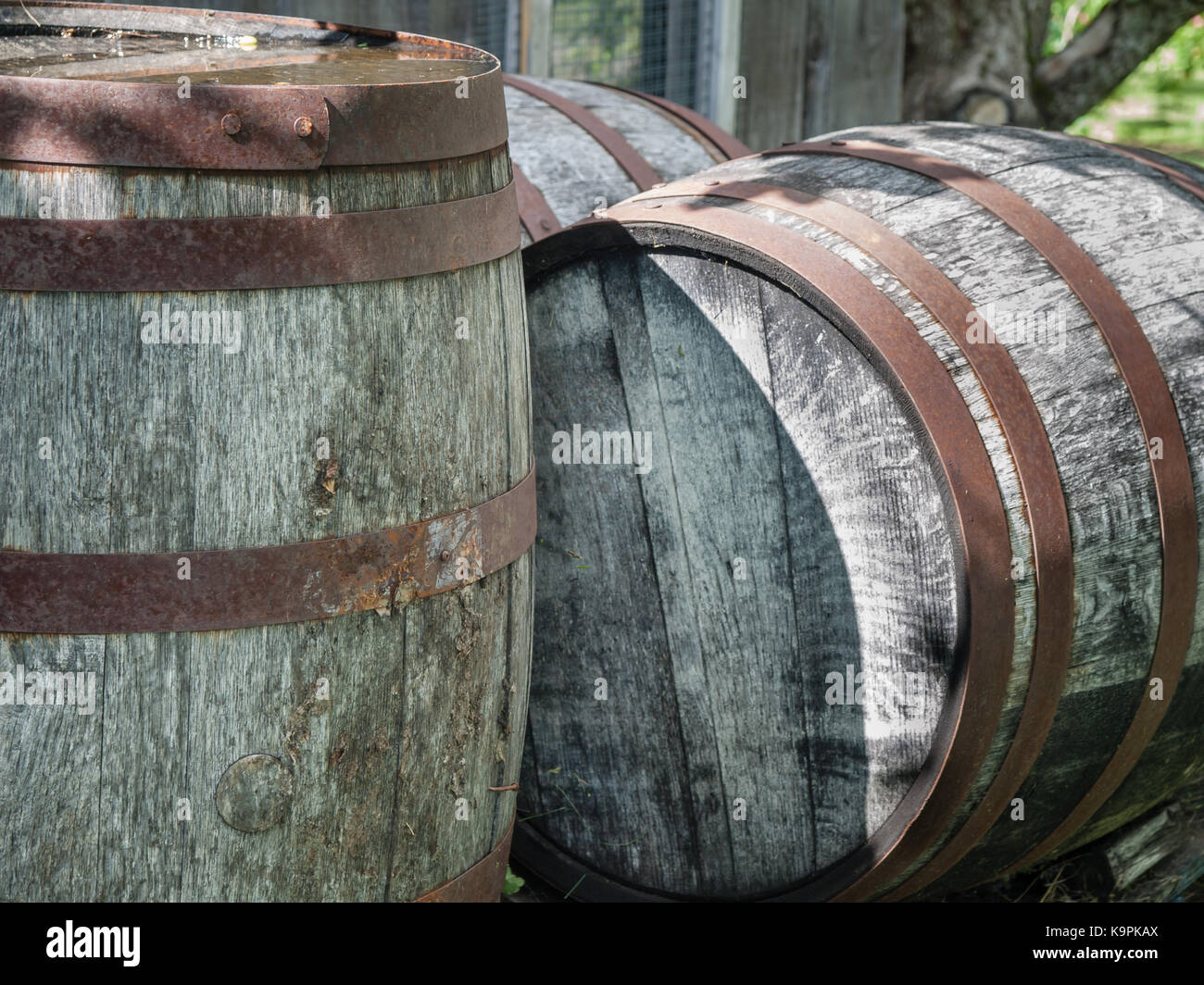 Old rusted wine barrel outside Stock Photo - Alamy