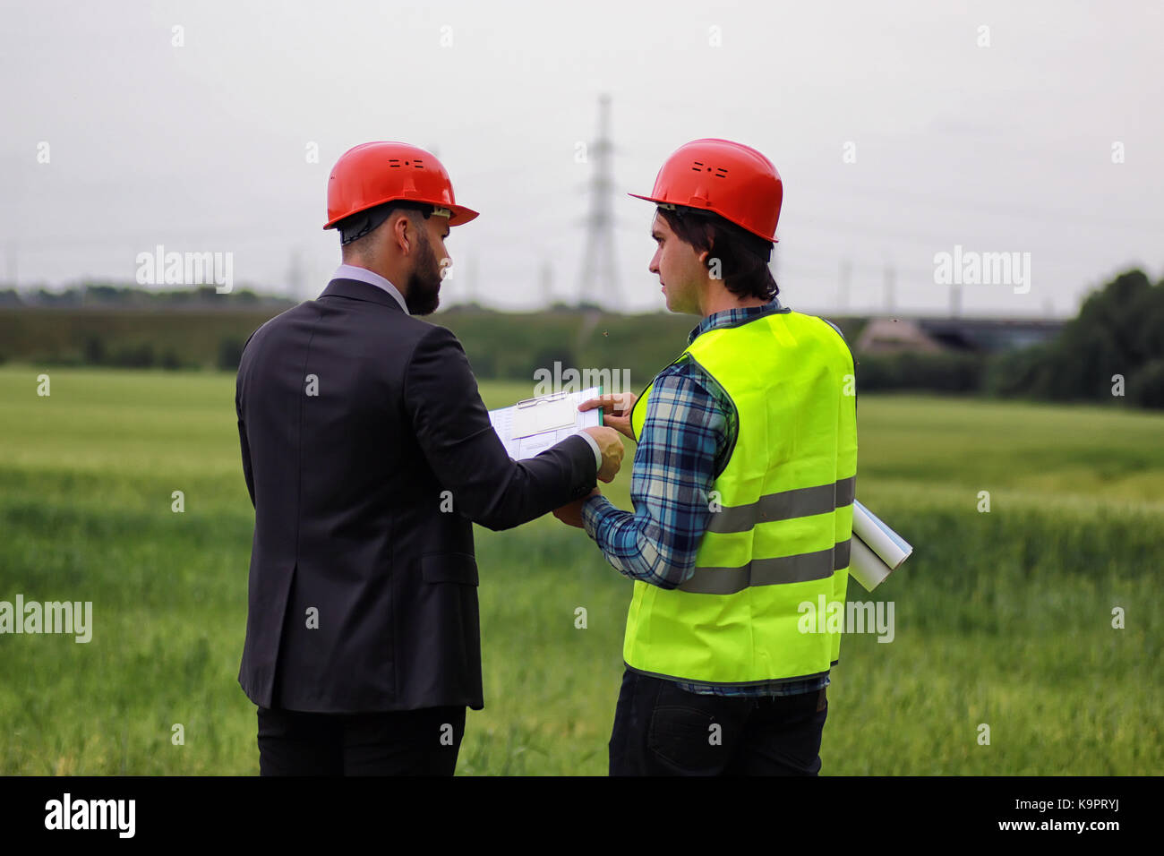 construction two man in the field Stock Photo - Alamy