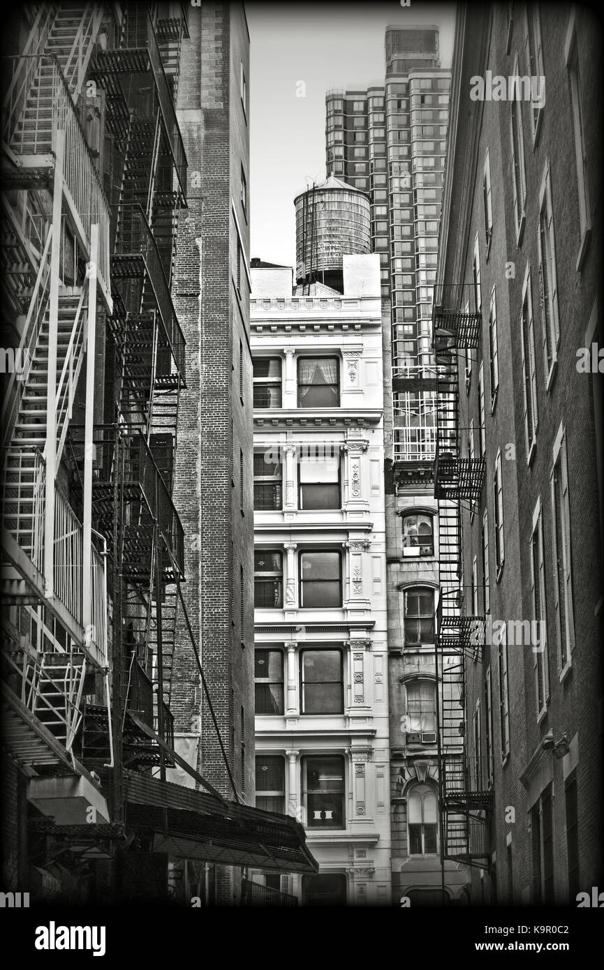 Iron fire escape stairs and balconys on the facade of a building in ...